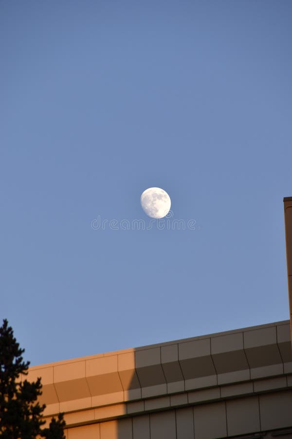 The Moon in the Sky and the Administrative Building Stock Image - Image ...