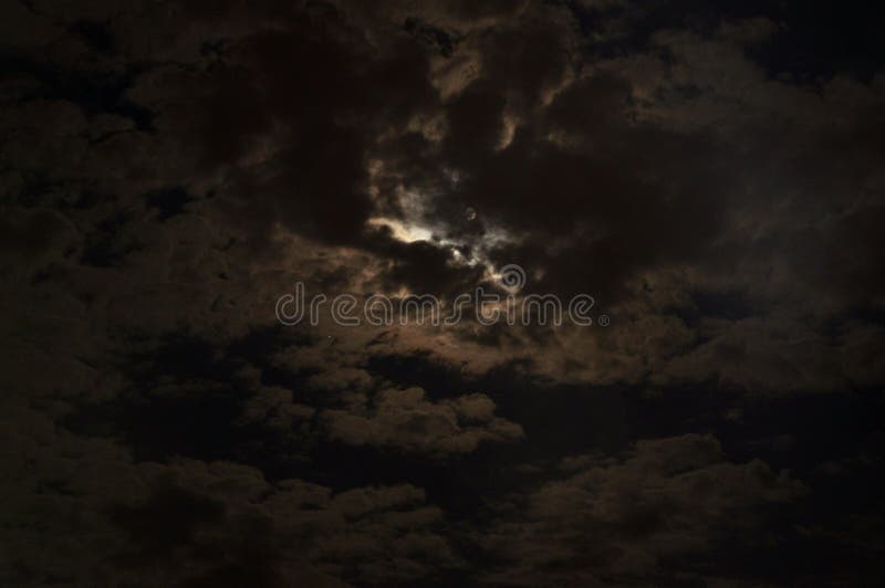 Moon. Slightly Cloudy Night Sky, the Moon Shining Brightly through the ... Moon. Slightly Cloudy Night Sky, the Moon Shining Brightly through the ...