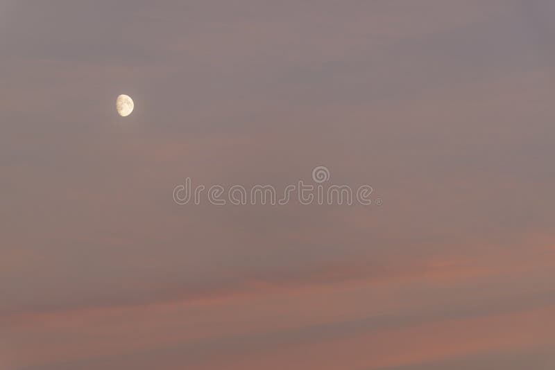 The moon at sunset stock photo. Image of cloured, moon - 78408696