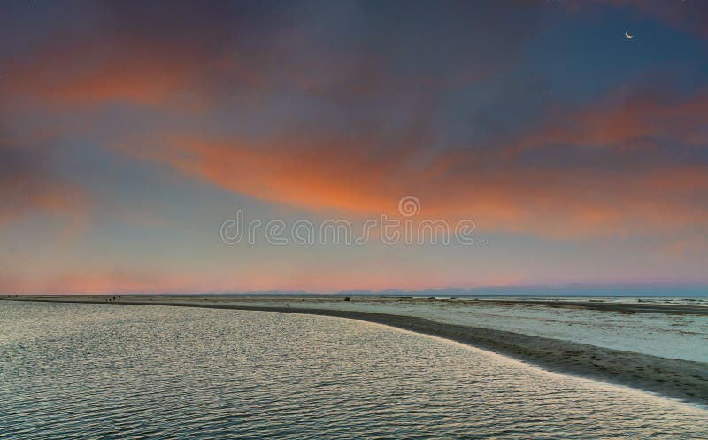 Moon at Sunset Over Tidewater Stock Photo - Image of beach, tidal ...