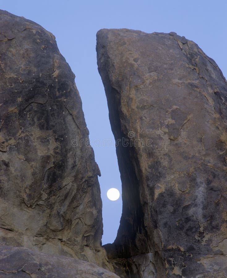 The Moon between Two Rocks stock photo. Image of rocks - 26265174