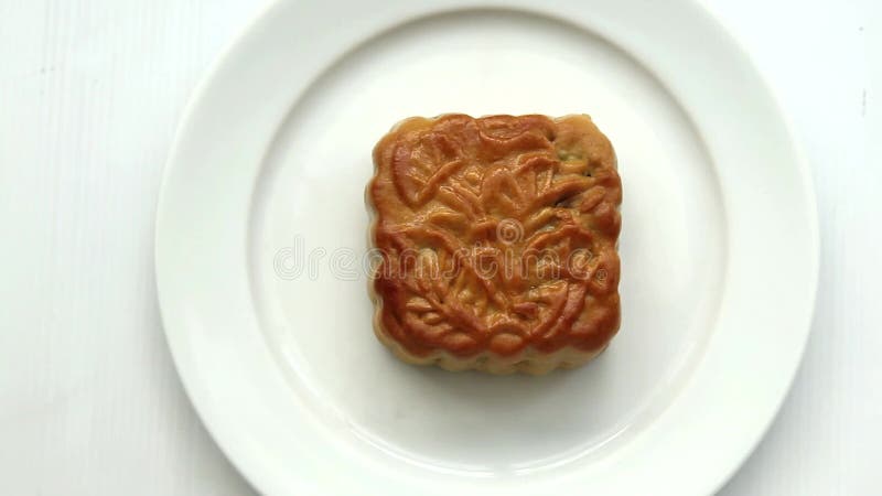 Mooncake on a White Plate Isolated on White Stock Video - Video of ...