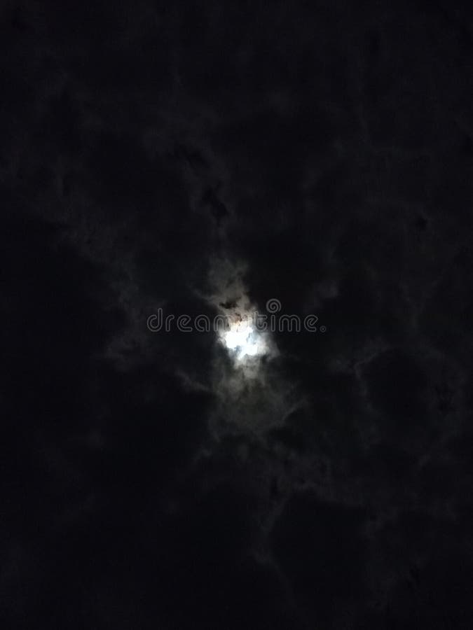 Moonlight Amidst the Clouds in the Night Sky Stock Image - Image of ...