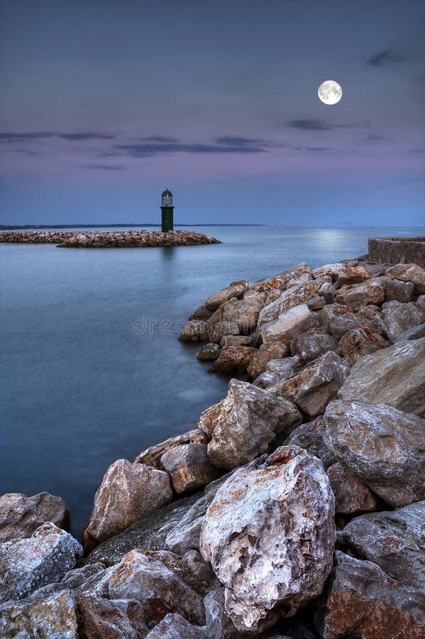 Moonlight Bay Moon Lighthouse Stock Photo - Image of relaxing, dusk ...