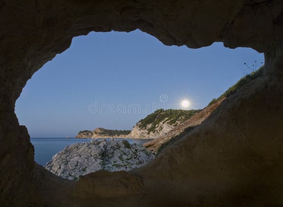 Moonlight through a cave stock image. Image of full, seascape - 15761501