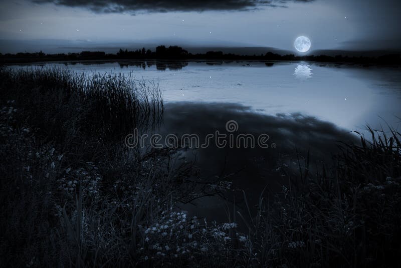 Moonlight over a lake stock photo. Image of mysterious - 18540794