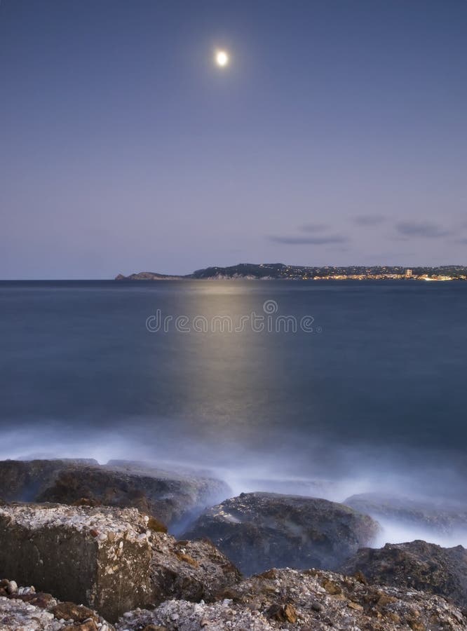 Moonlight on the sea stock image. Image of mountain, shore - 10762223
