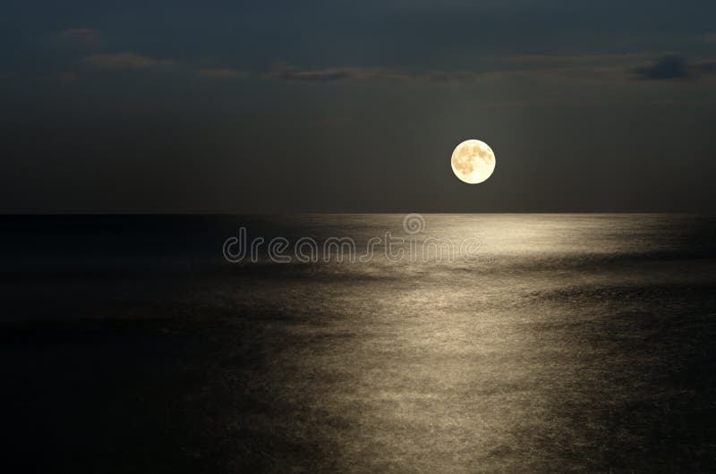 Moonlight on the Waves at Night in the Sea on Long Exposures Stock ...