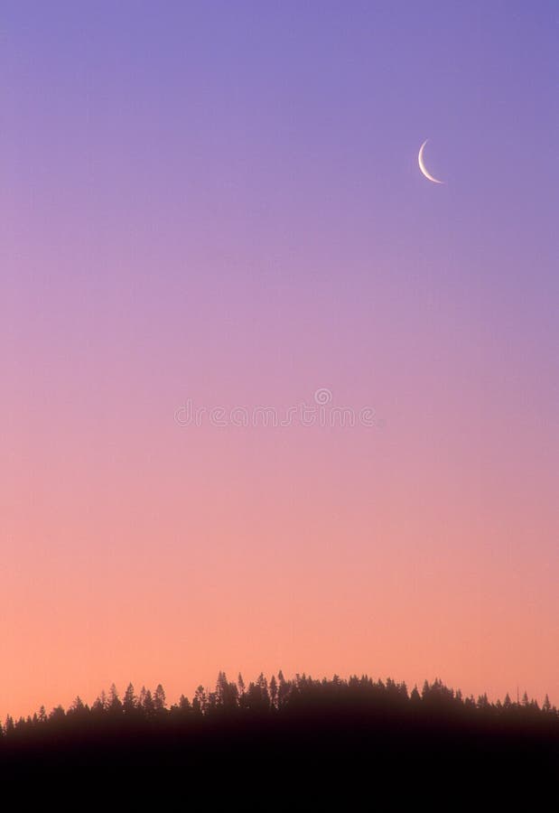 A Crescent Moon at Sunset Above Stock Photo - Image of natural, horizon ...