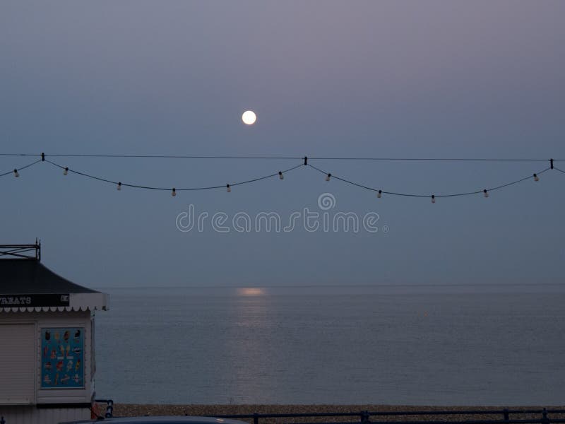 Moonrise at the seaside stock photo. Image of rising - 97441680