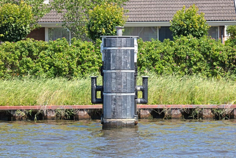 Mooring Post in a Dutch Canal Stock Image - Image of post, netherlands ...