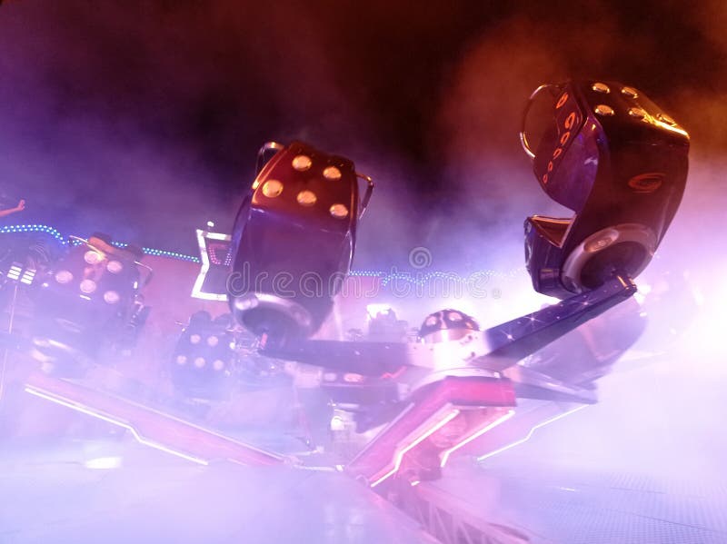 Mooving and Rotating Merry-go-round by Night, Bathered in Artificial ...