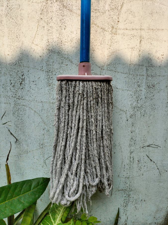 A Mop that is Being Dried after Use Stock Photo - Image of dust ...