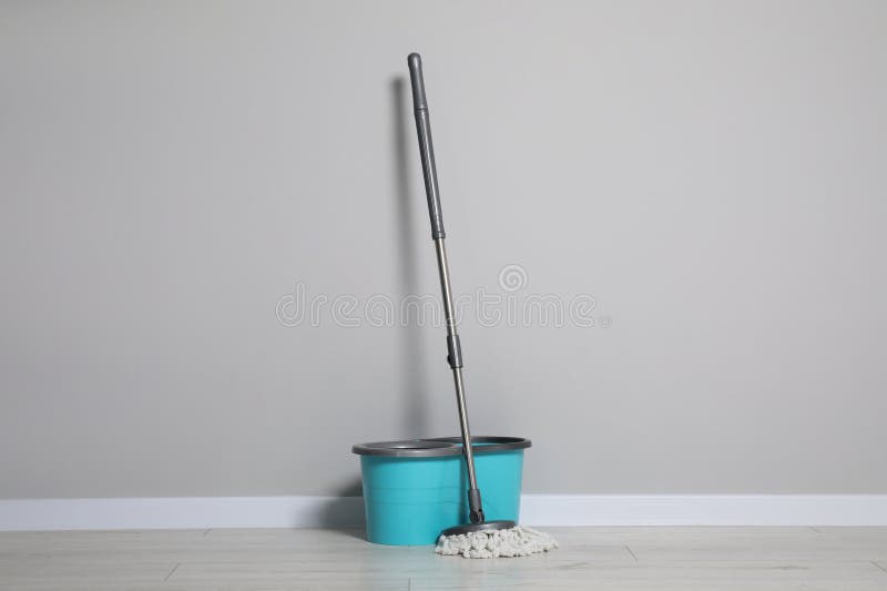Mop and Plastic Bucket Indoors. Cleaning Floor Stock Image - Image of ...