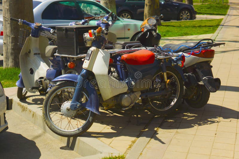 Mopeds and scooters parked stock image. Image of parked - 91553287