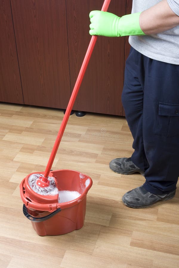 Cleaner Mopping With Wet Floor Sign With Bright Background Stock Image ...