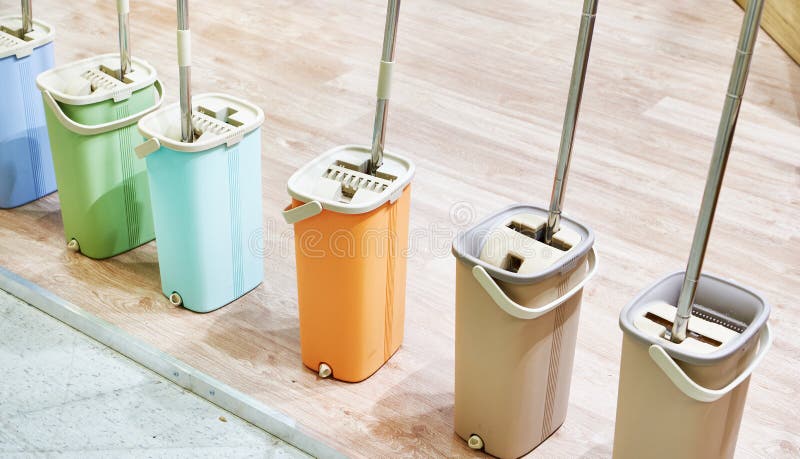 Mops with plastic buckets stock image. Image of shelf - 246363641