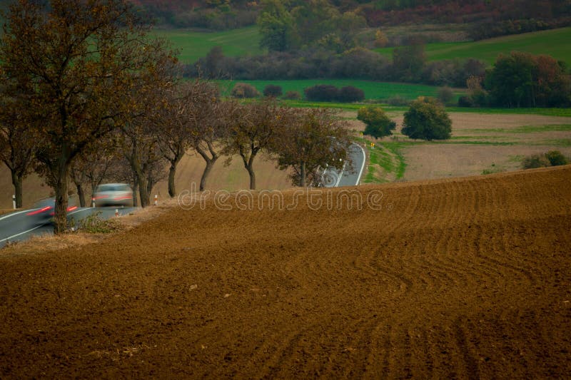 Moravian Brown Fields with a Road and Moving Cars Stock Image - Image ...