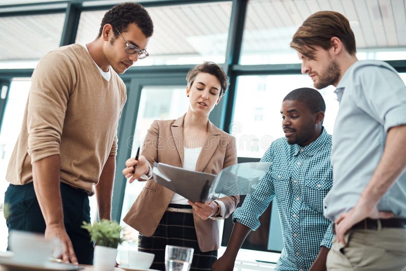 More Gets Done As a Team. a Group of Businesspeople Having a Discussion ...