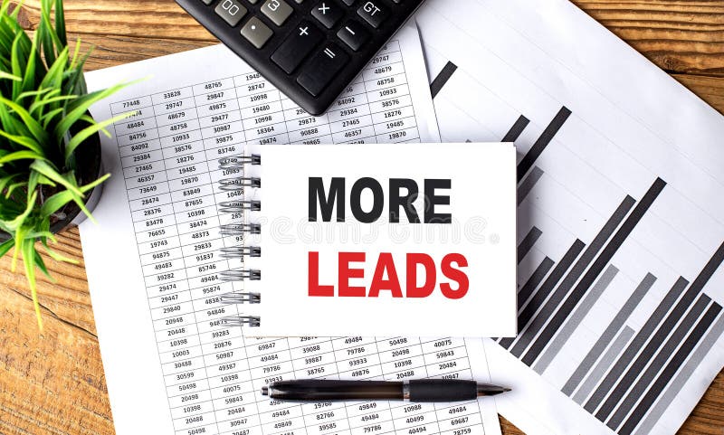 MORE LEADS Text on Notebook on Chart with Calculator and Pen Stock ...
