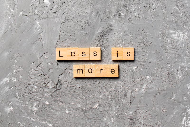Less is More Word Written on Wood Block. less is More Text on Table ...