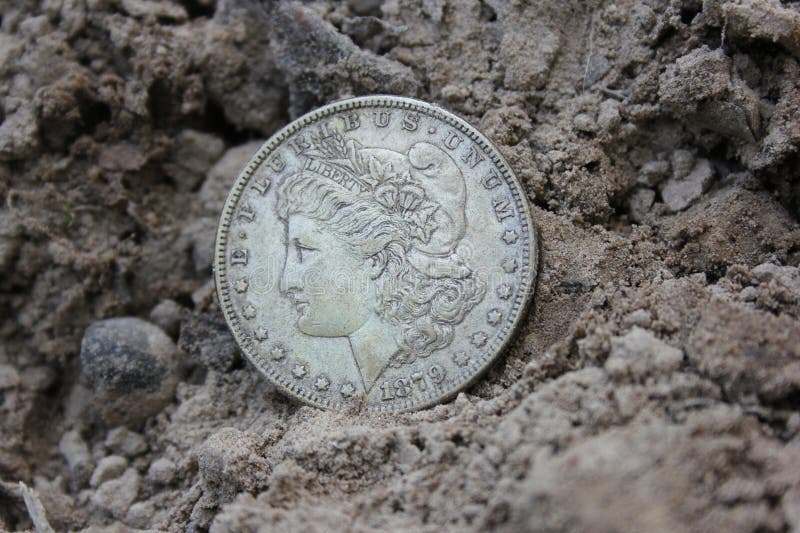 1879 Morgan Silver Dollar on Ground in Dirt Front View Stock Image ...
