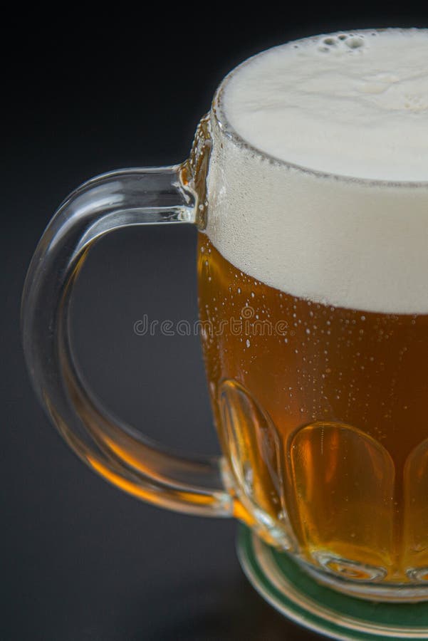 Cold Beer Jar with a Lot of Foam Cuted by Half Stock Image - Image of ...