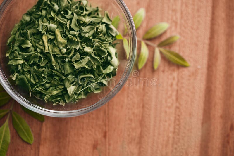 Moringa Leaf Powder in Glass Jar on Wooden Background Stock Image ...