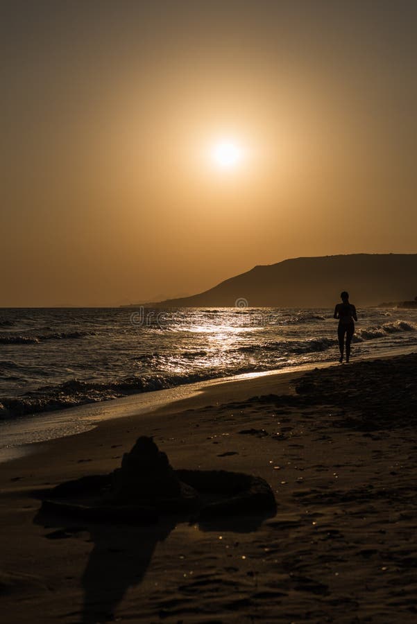Morning beach and runner stock photo. Image of greece - 137872752