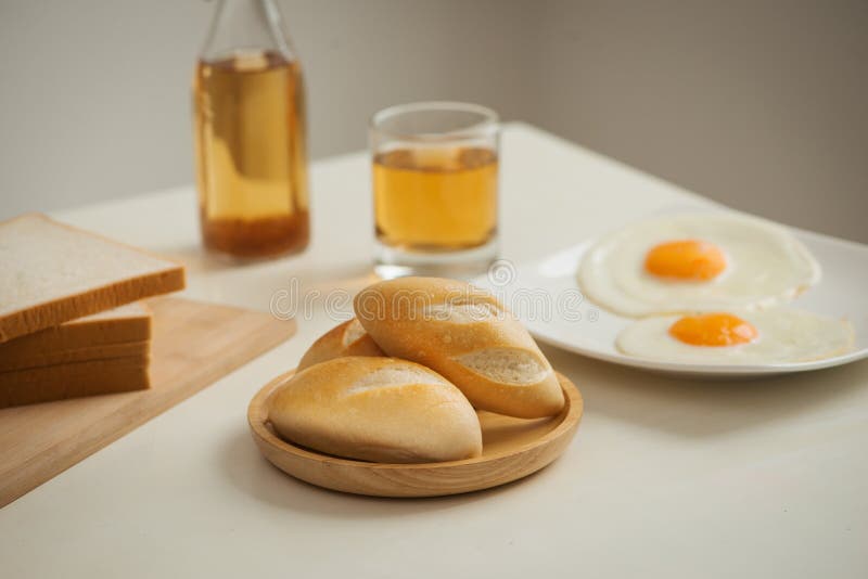 Morning Breakfast with Glass of Tea, Toast, Fried Eggs and Bread on ...