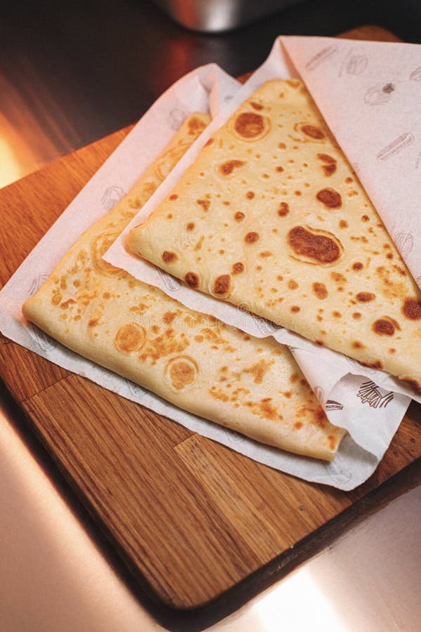 Thin Pancakes with Ham and Cheese in an Envelope are Placed on a ...