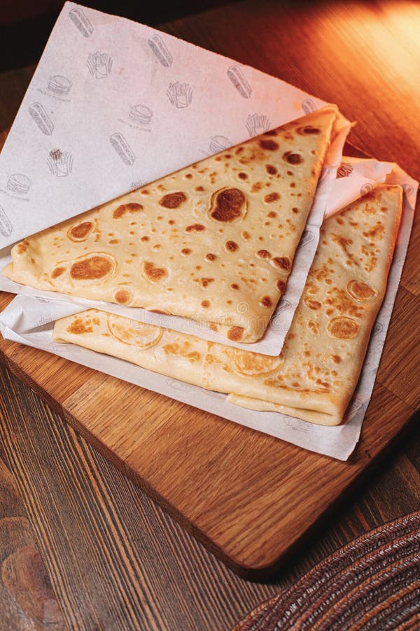 Thin Pancakes with Ham and Cheese in an Envelope are Placed on a ...