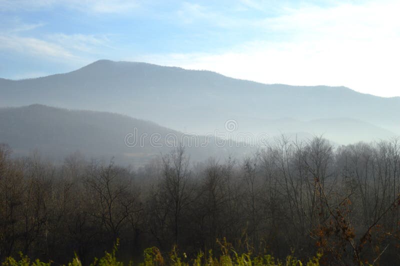 Morning fog over the hills stock photo. Image of hills - 207241596