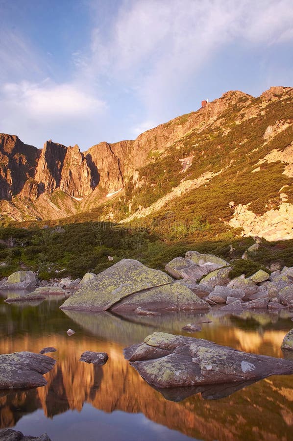 Giant Mountains Have Grown To Clouds and are Reflected in the Sea ...