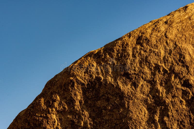Morning LIght Highlights the Texture of Giant Boulder and Blue Sky ...