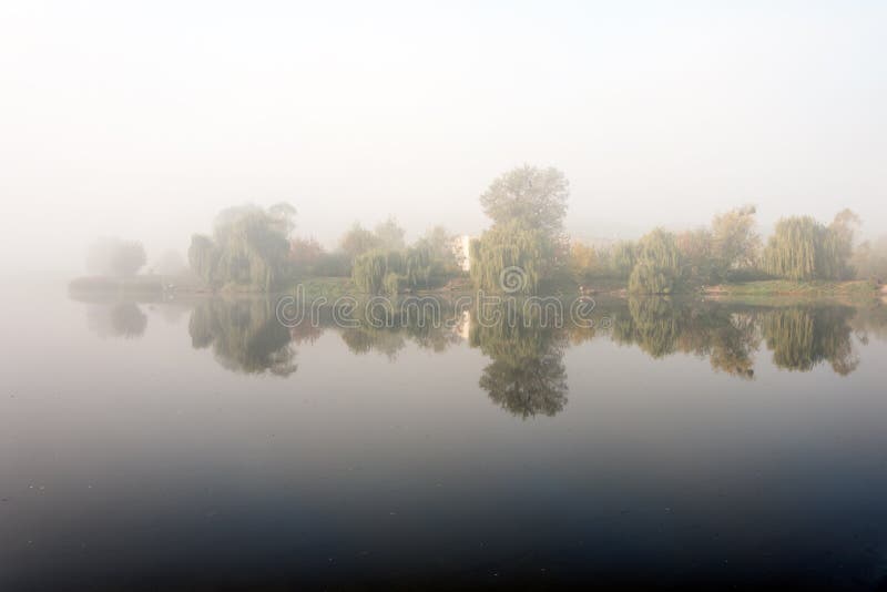 Morning Mist Over the Lake with Reflection in the Water. Fog on a River ...