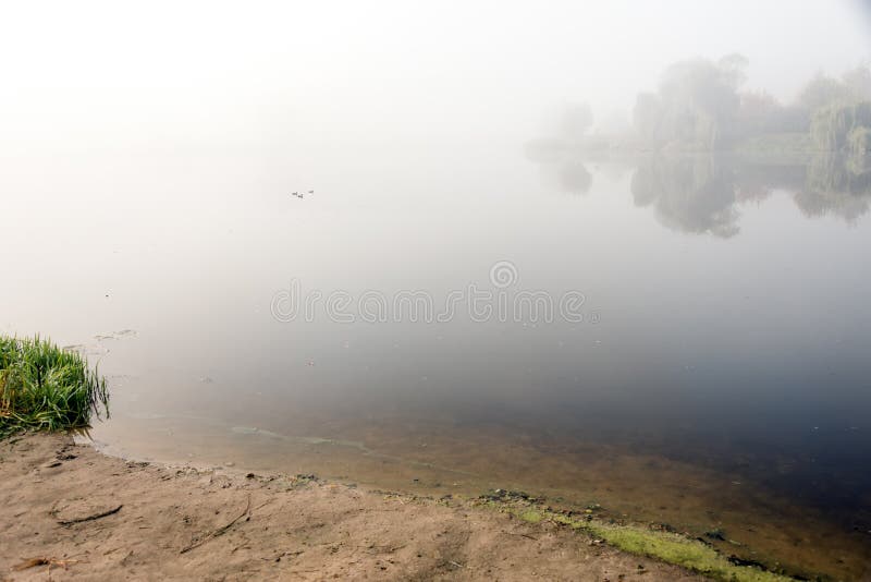 Morning Mist Over the Lake with Reflection in the Water. Fog on a River ...
