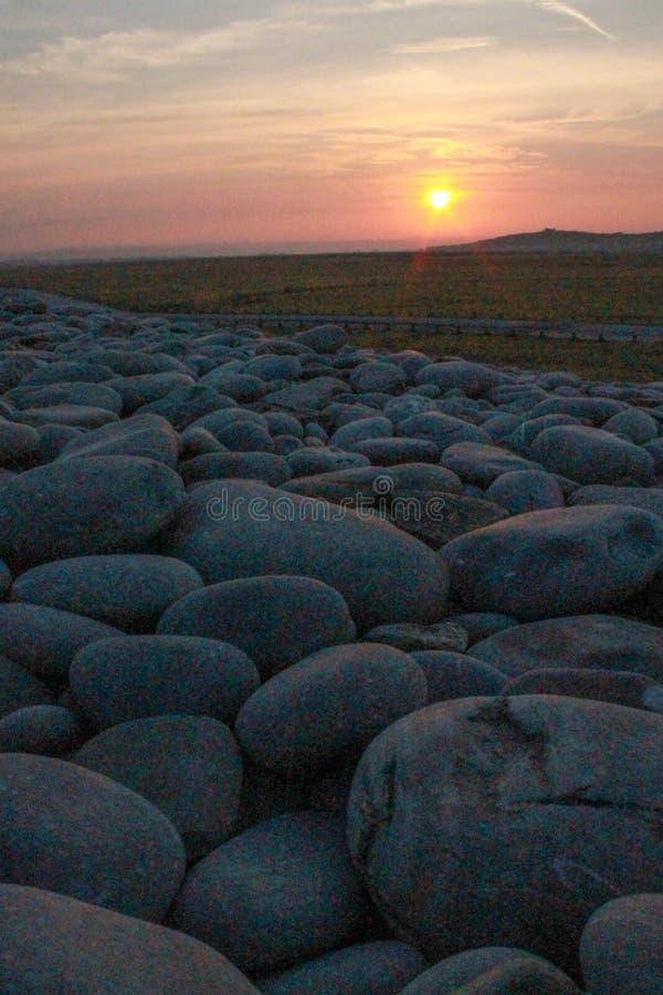 Morning on the Pebbled Ridge Stock Photo - Image of flare, beach: 42906212