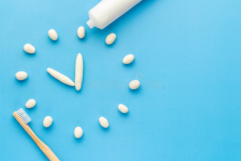 Morning Routine Concept. Clock Made of Toothpaste with Toothbrushes ...