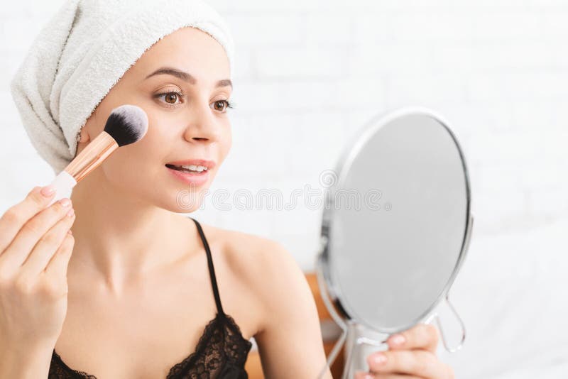 Young Woman Applying Makeup, Sitting after Shower in Bed Stock Image ...