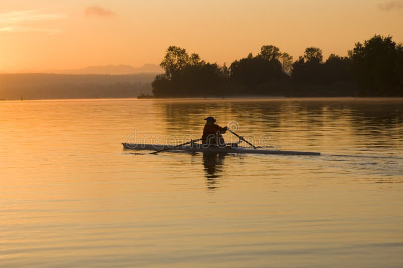 Single rower at sunrise stock image. Image of lifestyle - 7060693