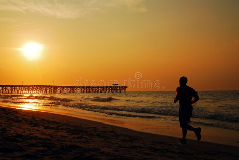 Morning Run on the Shore stock image. Image of beach - 76748377