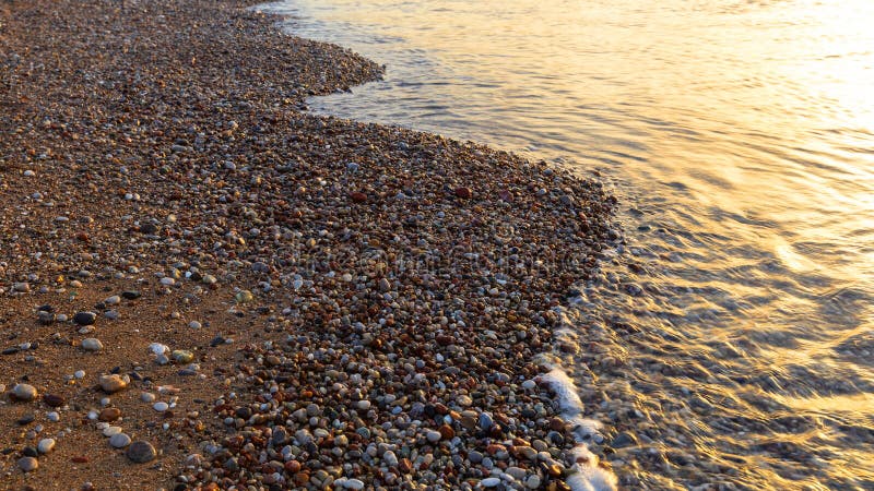 Morning Sand - Pebble Beach Illuminated by the First Rays of the Sun ...
