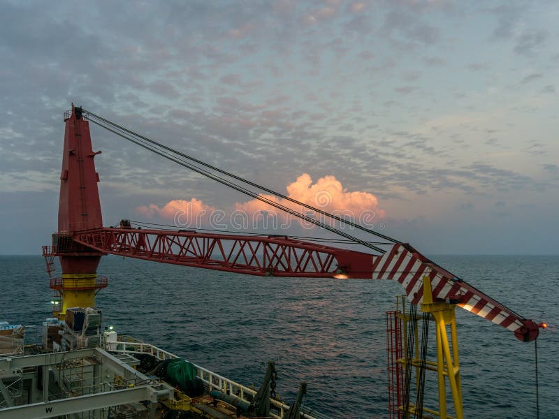 An Offshore Construction Crane Lifting Anchor Buoy For Deployment Stock ...