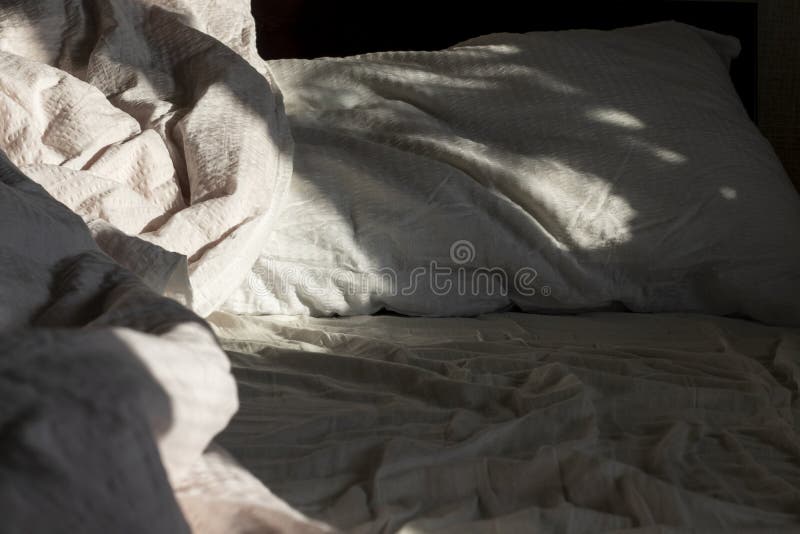 Morning Shadows Illuminate the Empty Bed with White Crumpled Linen ...