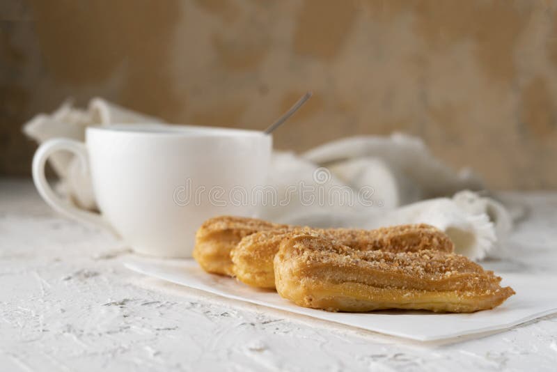 Morning Snack with Coffee and Creamy Eclair on a Table with White ...