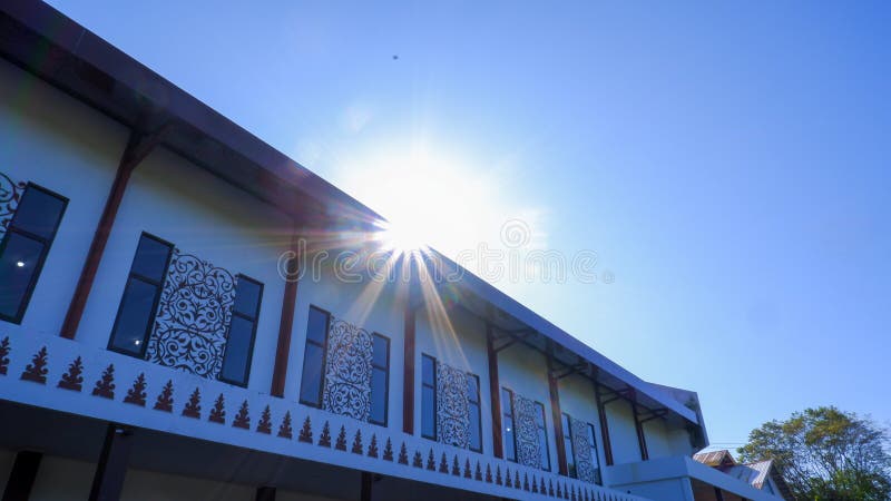 Morning Sunlight Rising Above the Roof of a Building Stock Image ...