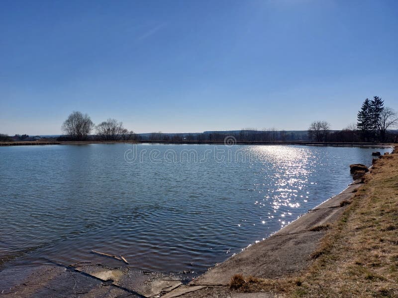 Sunny Lake View of the City Stock Photo - Image of water, clouds: 112416998