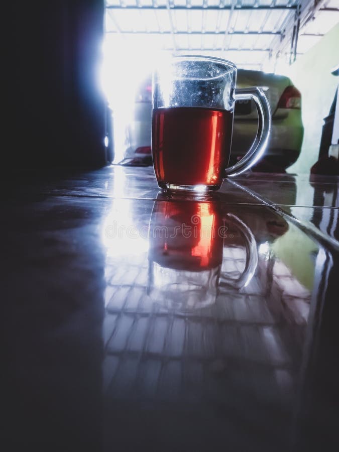 Morning tea reflection stock photo. Image of glass, darkness - 222473044