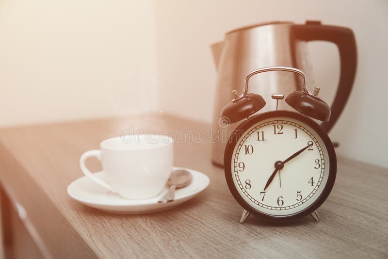 Morning Time with Bell Clock and Coffee or Tea Hot Drinks on Wooden ...